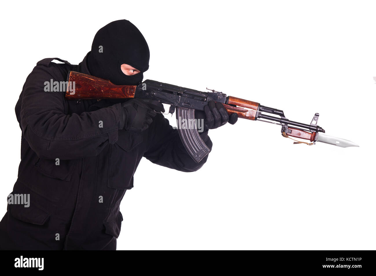 man in black uniform and mask with AK 47 gun Stock Photo - Alamy