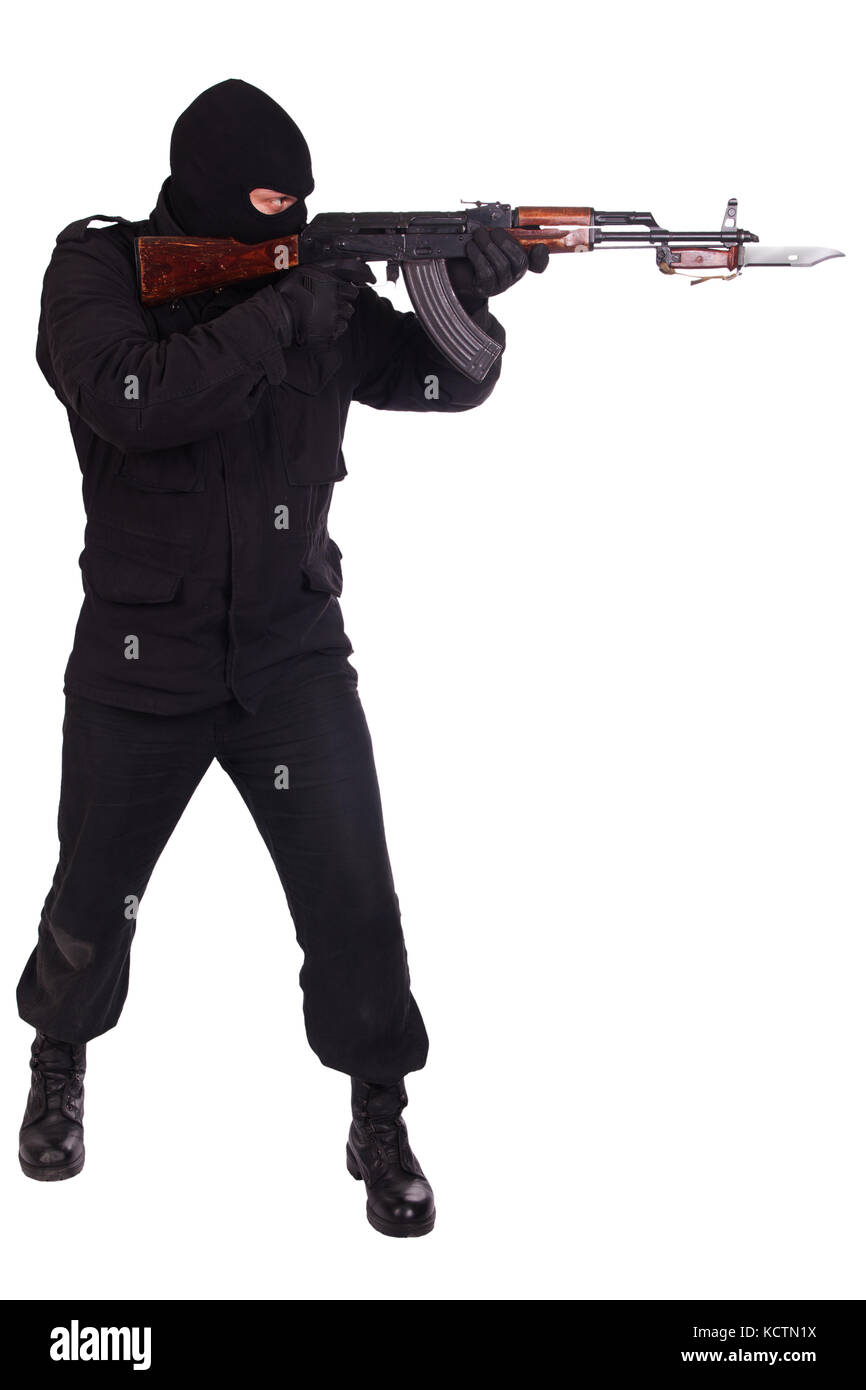 man in black uniform and mask with AK 47 gun Stock Photo - Alamy