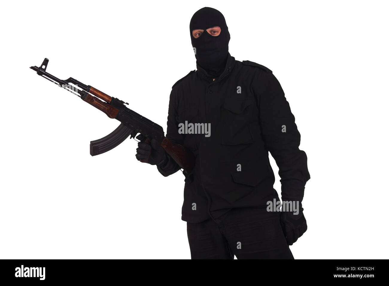 man in black uniform and mask with AK 47 gun Stock Photo - Alamy