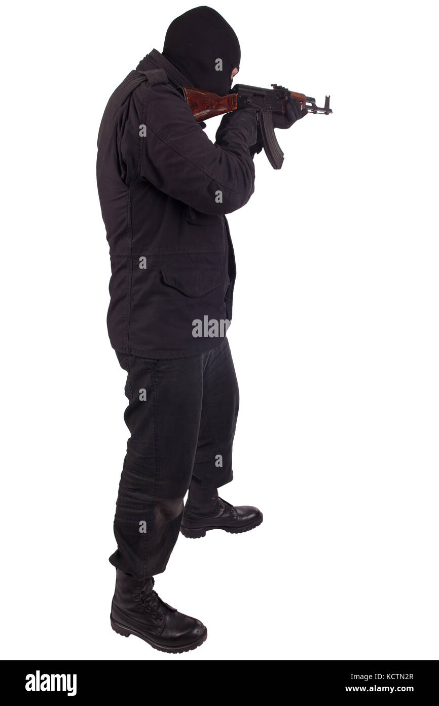 man in black uniform and mask with AK 47 gun Stock Photo - Alamy