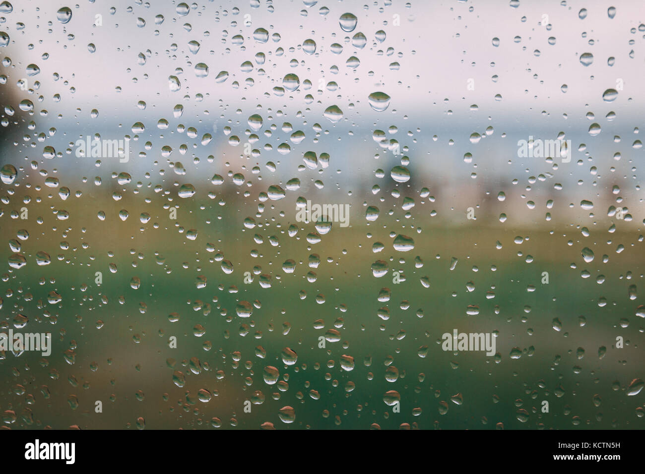 Close up of drops of rain on a glass window Stock Photo - Alamy