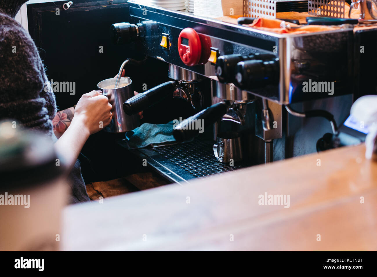 Professional coffee maker in shop Stock Photo - Alamy