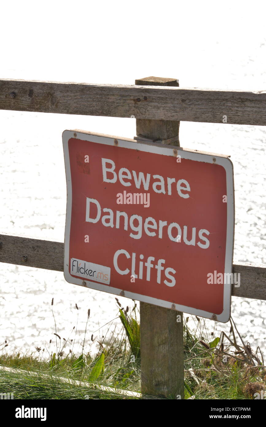 A Beware Dangerous Cliffs sign on the coastal path, Filey, North ...