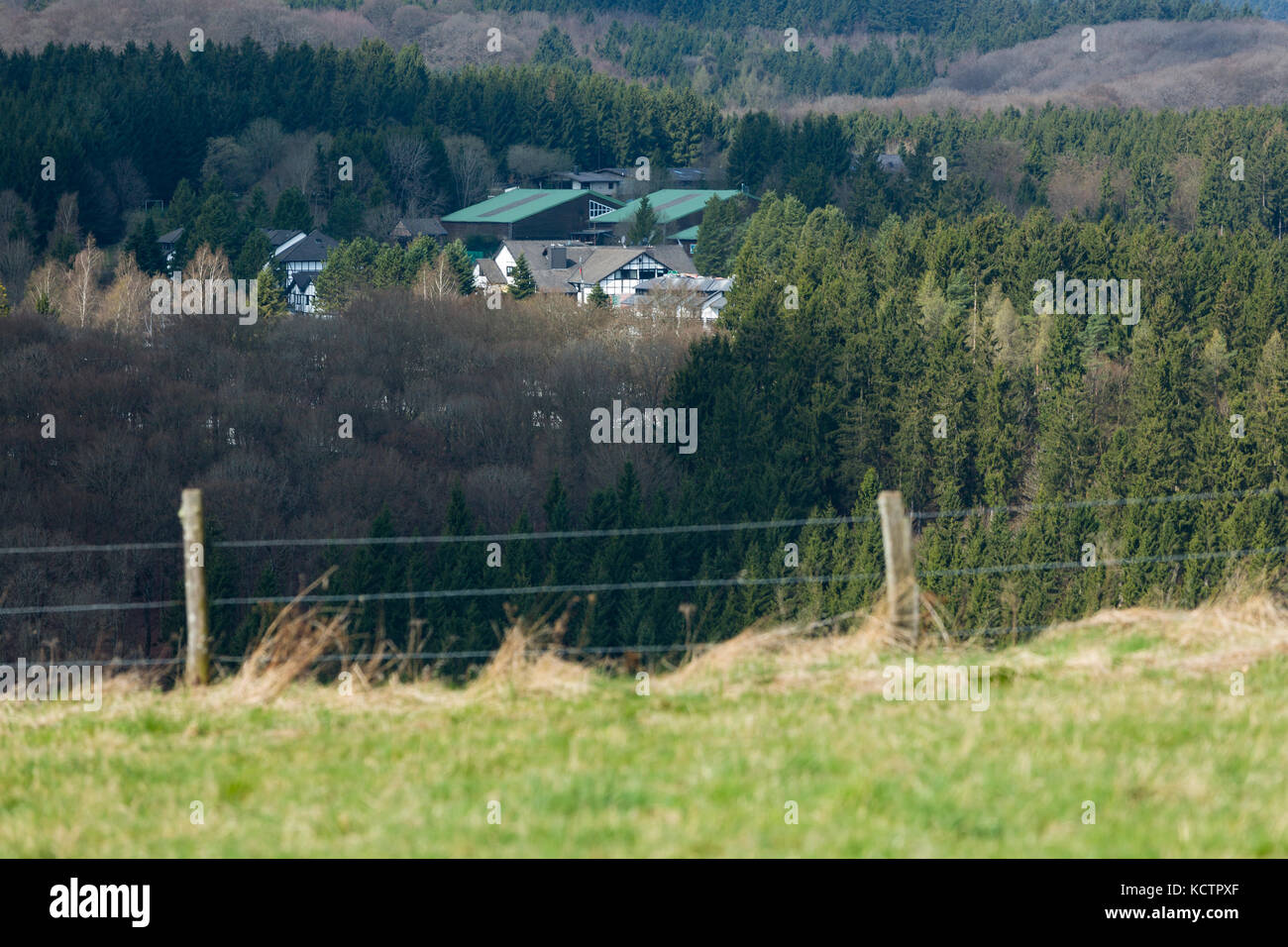 View over the southern Eifel hills near Daun, Germany to a large hotel ...