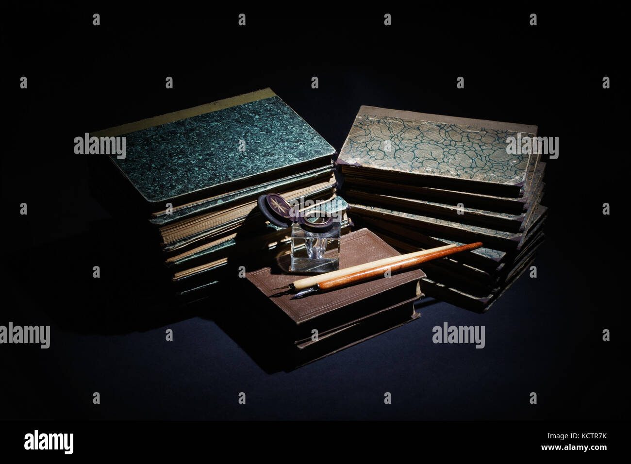 old books, papers, ink pen and inkpot on black background Stock Photo ...