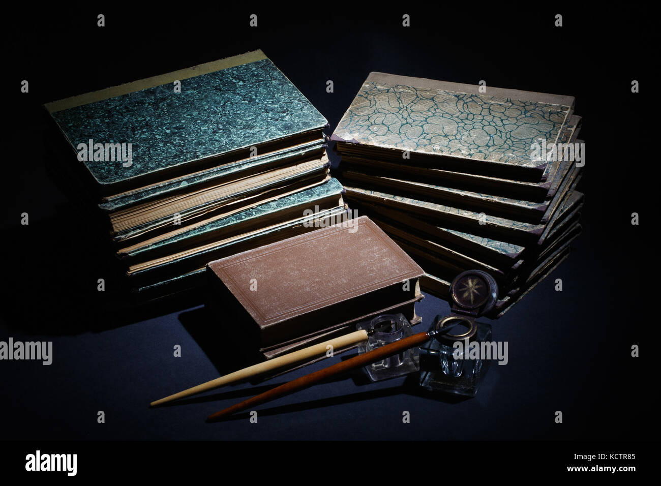 old books, papers, ink pen and inkpot on black background Stock Photo ...