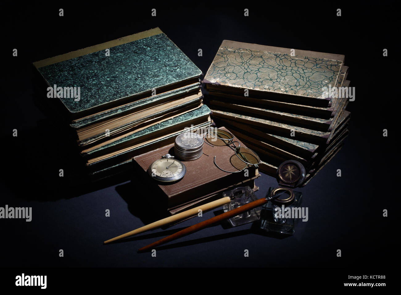 old books, papers, ink pen and inkpot on black background Stock Photo ...