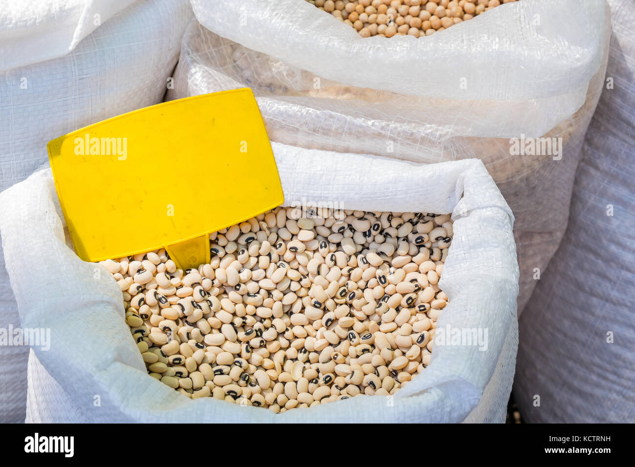 Raffia sack with beans for sale at the market Stock Photo - Alamy