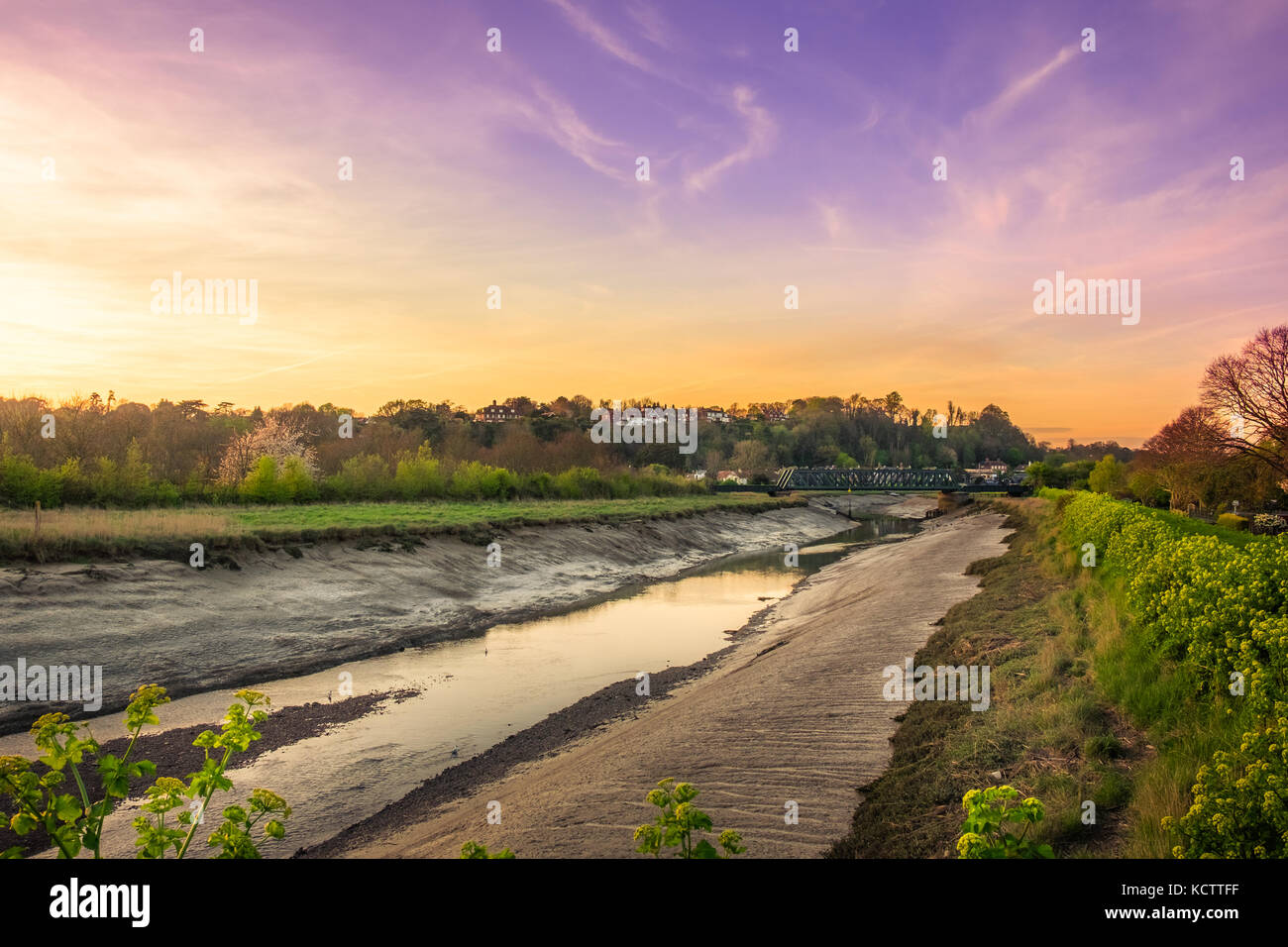 Sunset over the river Rother at low tide, Rye, East Sussex, England ...