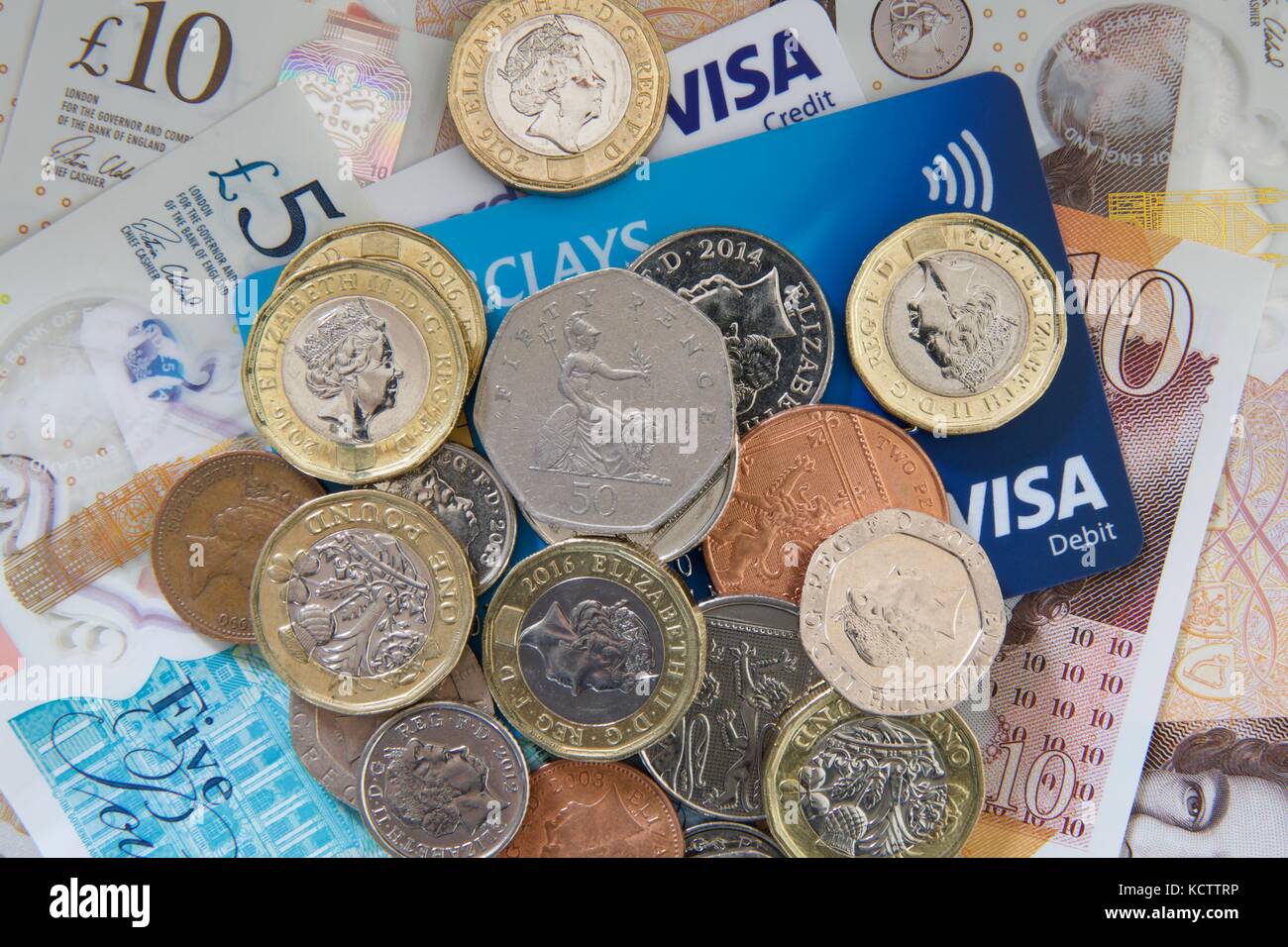 British banknotes and coins with a contactless payment card Stock Photo ...