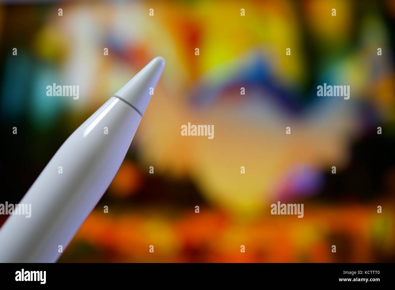 Apple Pencil with a colourful background Stock Photo - Alamy