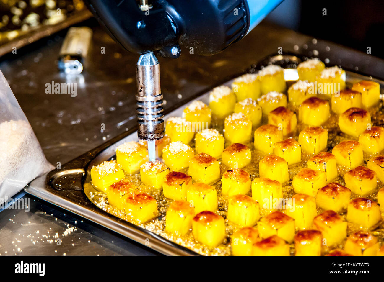 The gas flame is used to roast the gourmet dessert at Rheingau Gourmet ...