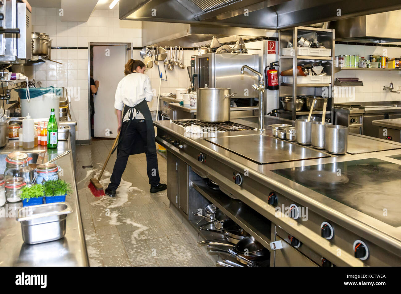Cleaning the professional Kitchen after Dinner Stock Photo - Alamy