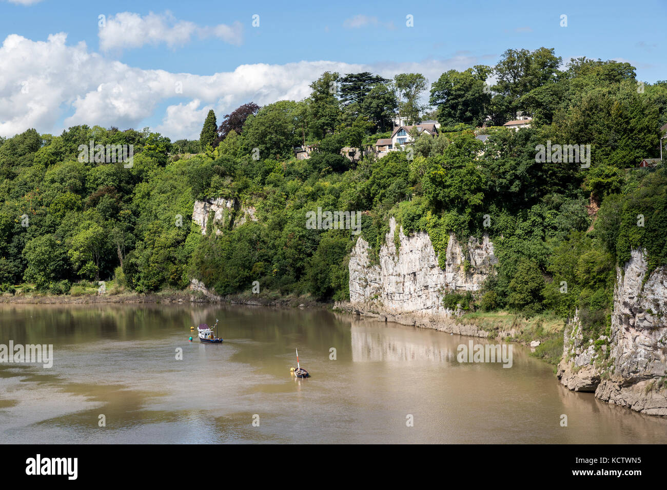 Cliffs with overlooking houses on the River Wye at Chepstow, Wales, UK ...