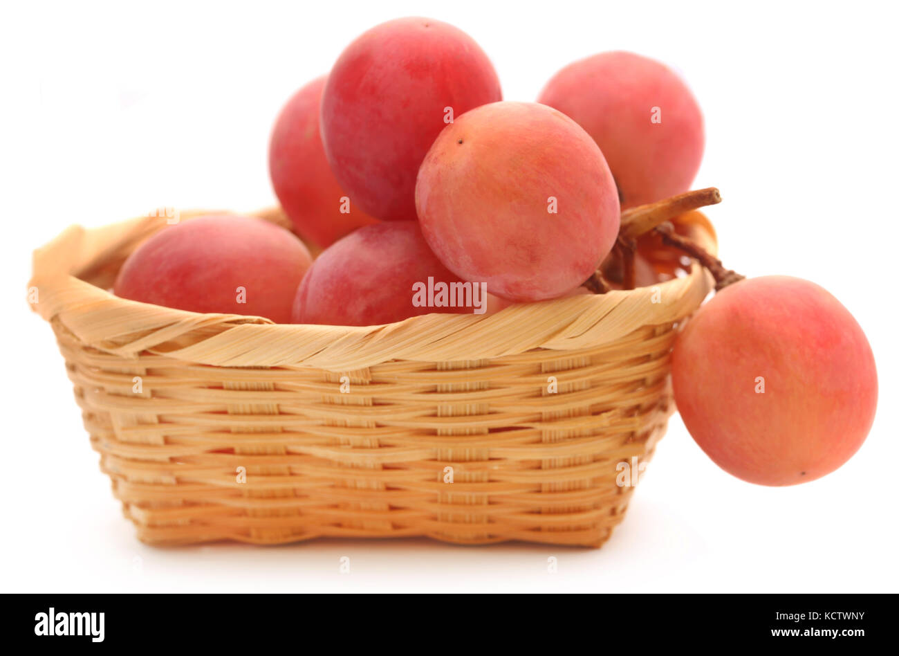 Organic red grapes over white background Stock Photo - Alamy
