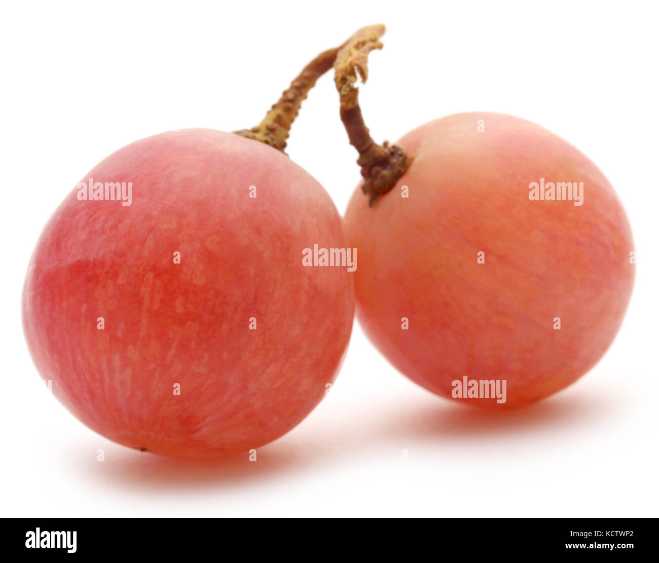 Organic red grapes over white background Stock Photo - Alamy