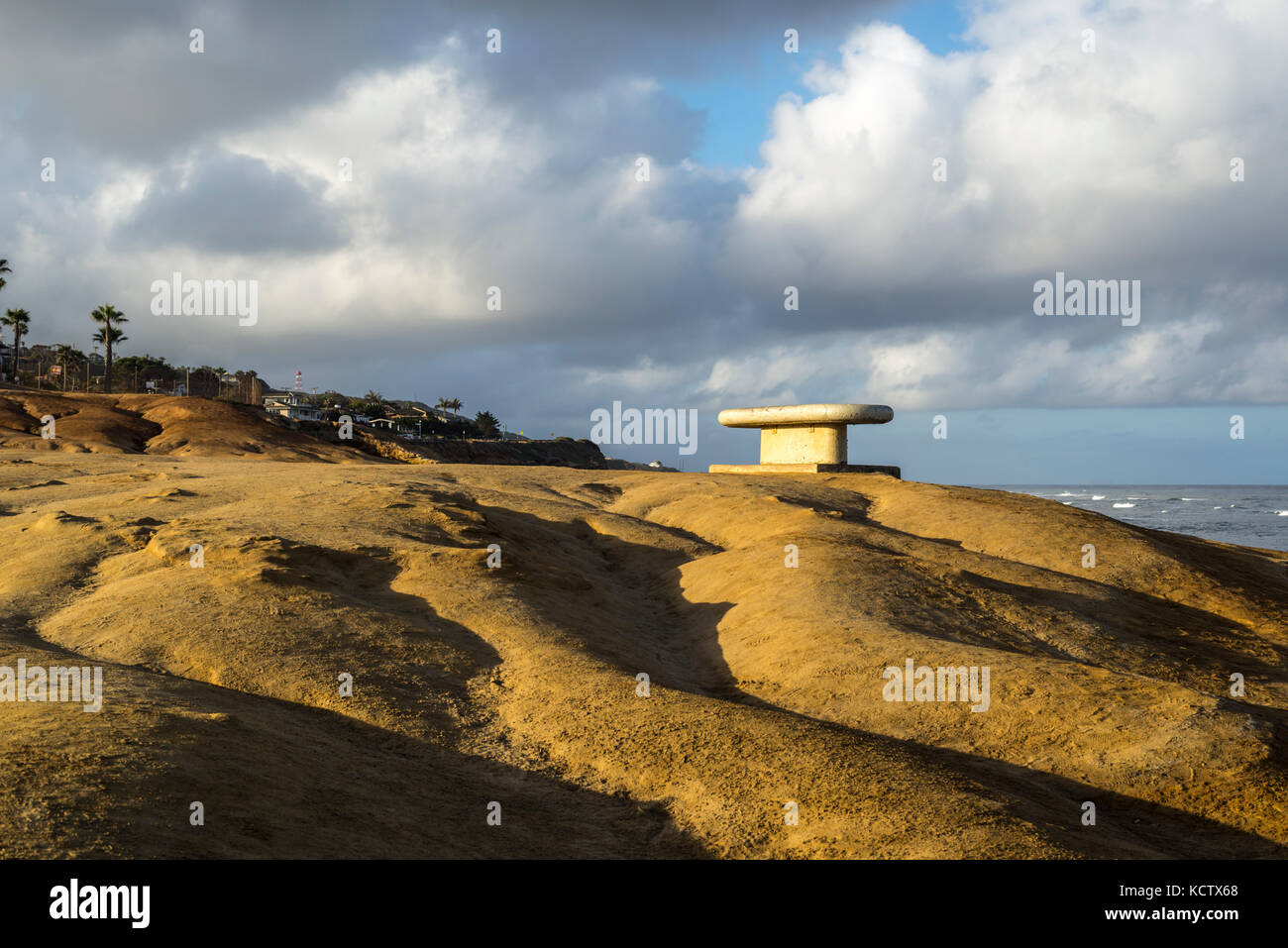 Public bench at an overlook point above the Pacific Ocean. Sunset ...