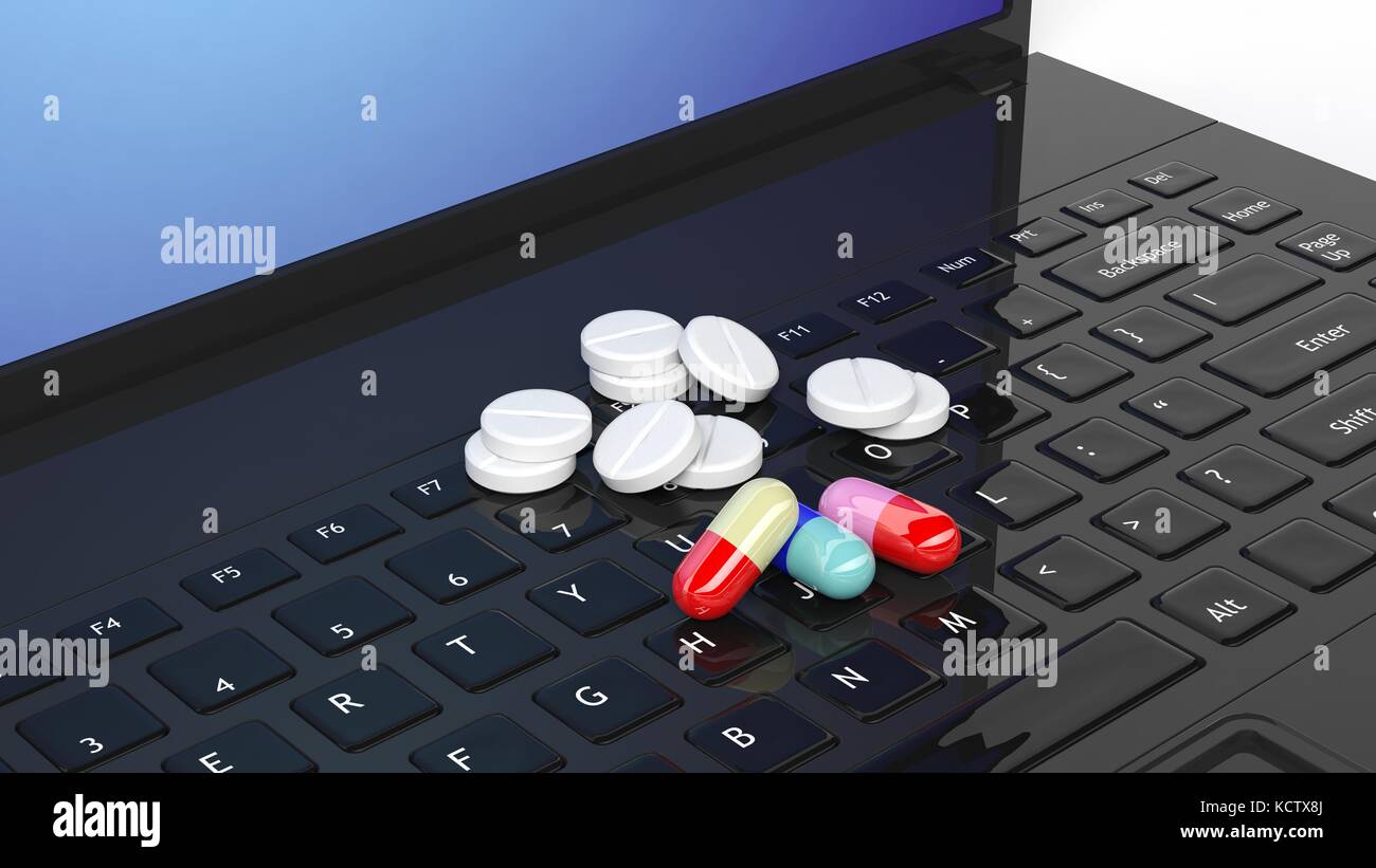 Pills on laptop keyboard, isolated on white background Stock Photo - Alamy