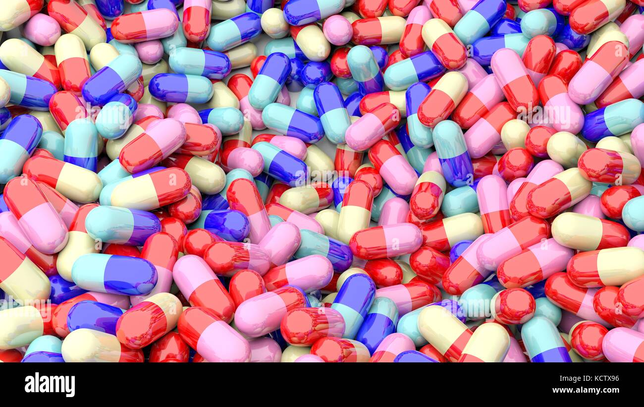 Colorful caplets pile background Stock Photo - Alamy