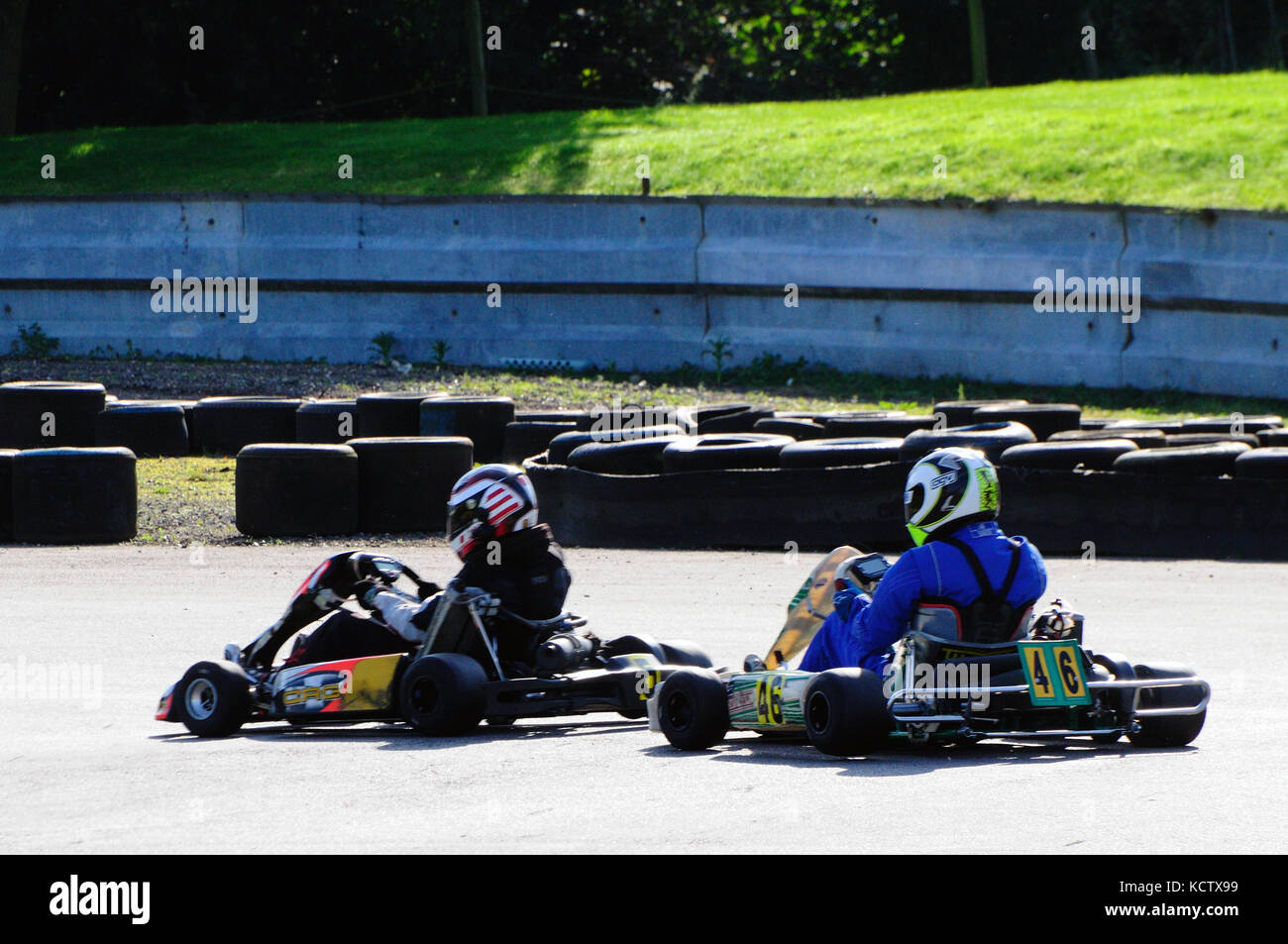 Go karting around a race track Stock Photo - Alamy
