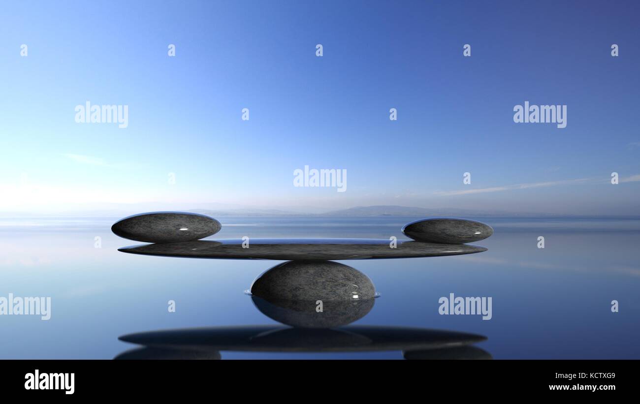 Balancing Zen stones in water with blue sky and peaceful landscape ...