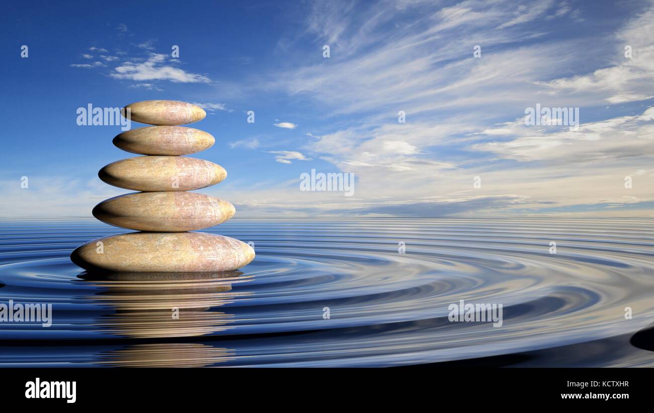 Zen stones stack from large to small in water with circular waves and ...