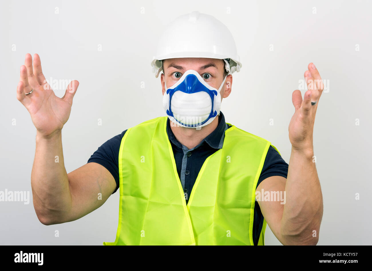 worker in white helmet and respirator Stock Photo - Alamy
