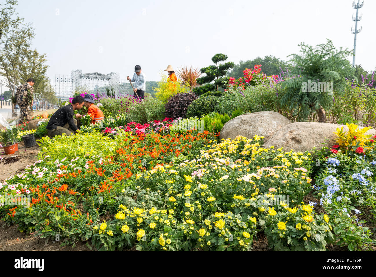 Flowers making china beautiful, workers planting flowers Stock Photo ...