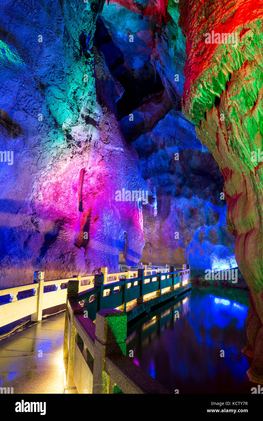 Underground illuminated caves in china Stock Photo - Alamy