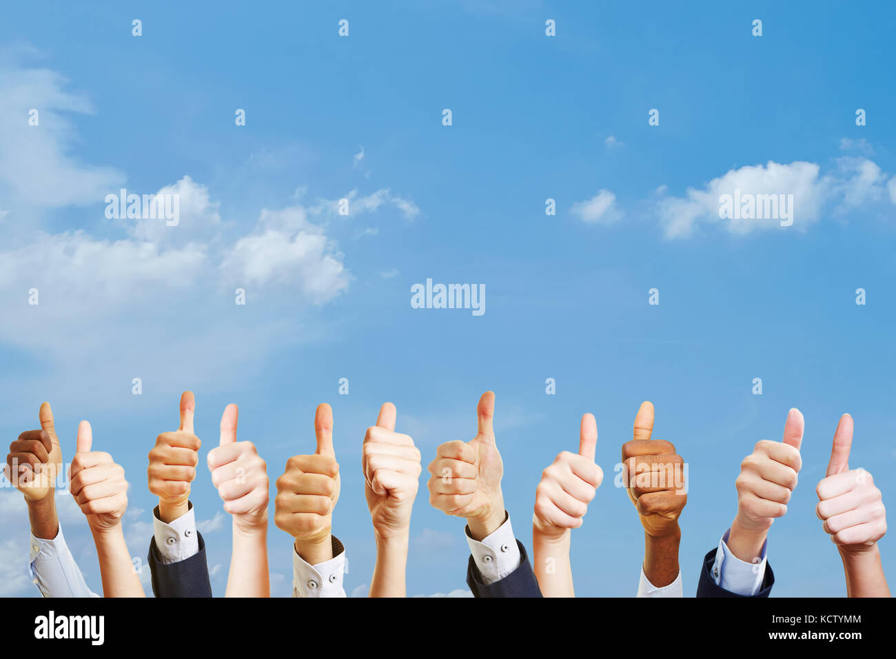Many hands holding thumbs up as motivation at work concept Stock Photo ...
