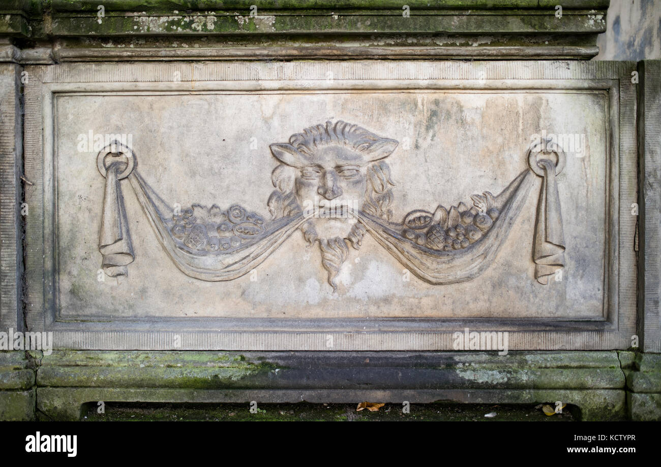 Ornaments, moldings, gargoyle, low reliefs in a sandstone, granite ...