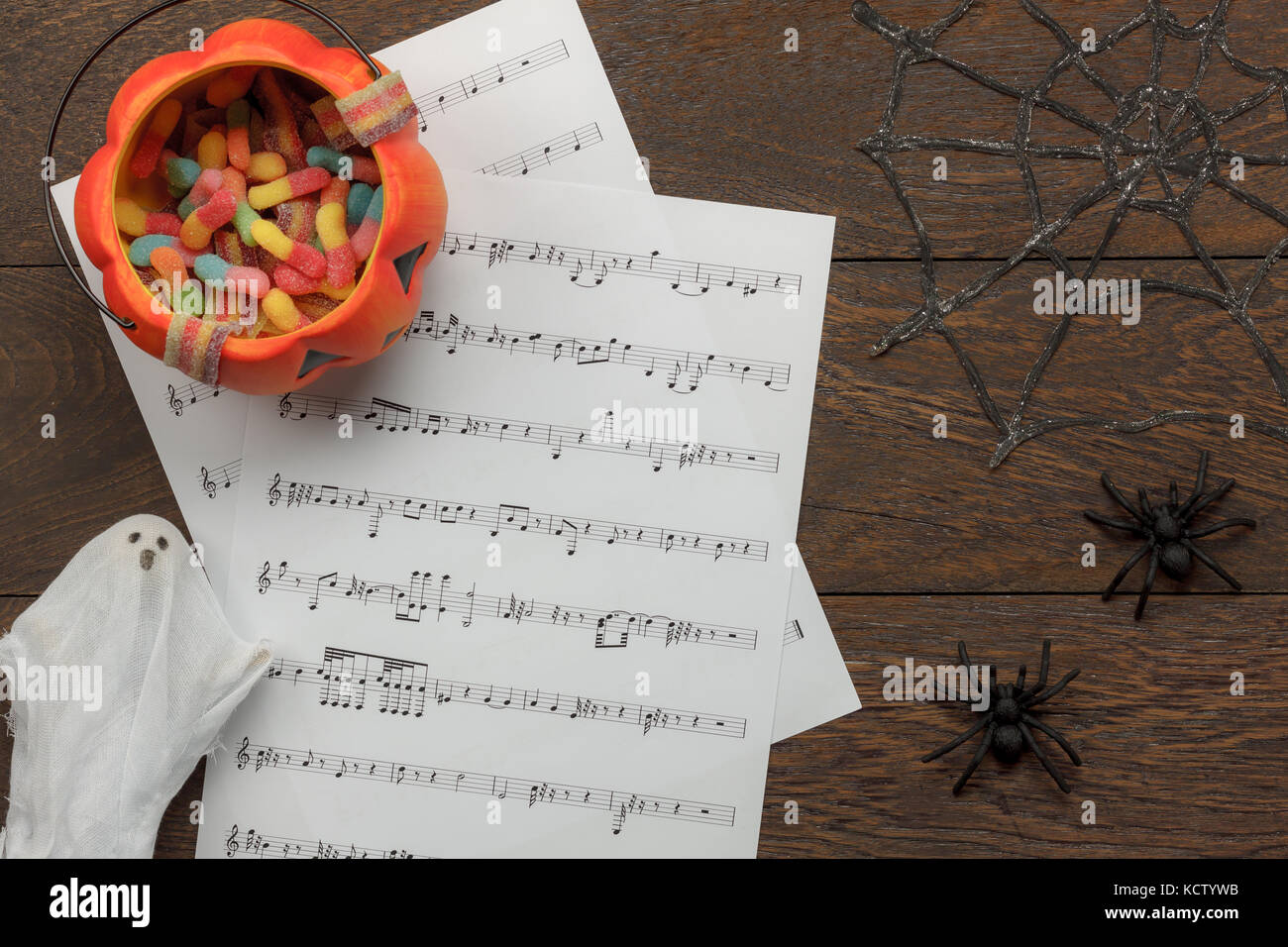 Above view of Happy Halloween Festival and music note sheet background ...