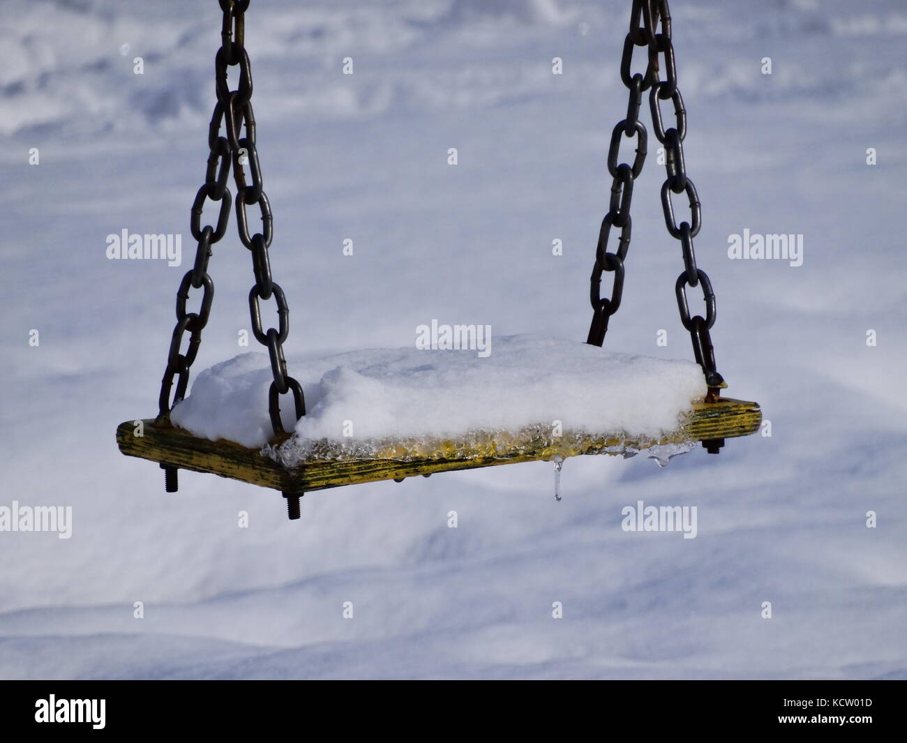 Swing covered in snow Stock Photo - Alamy