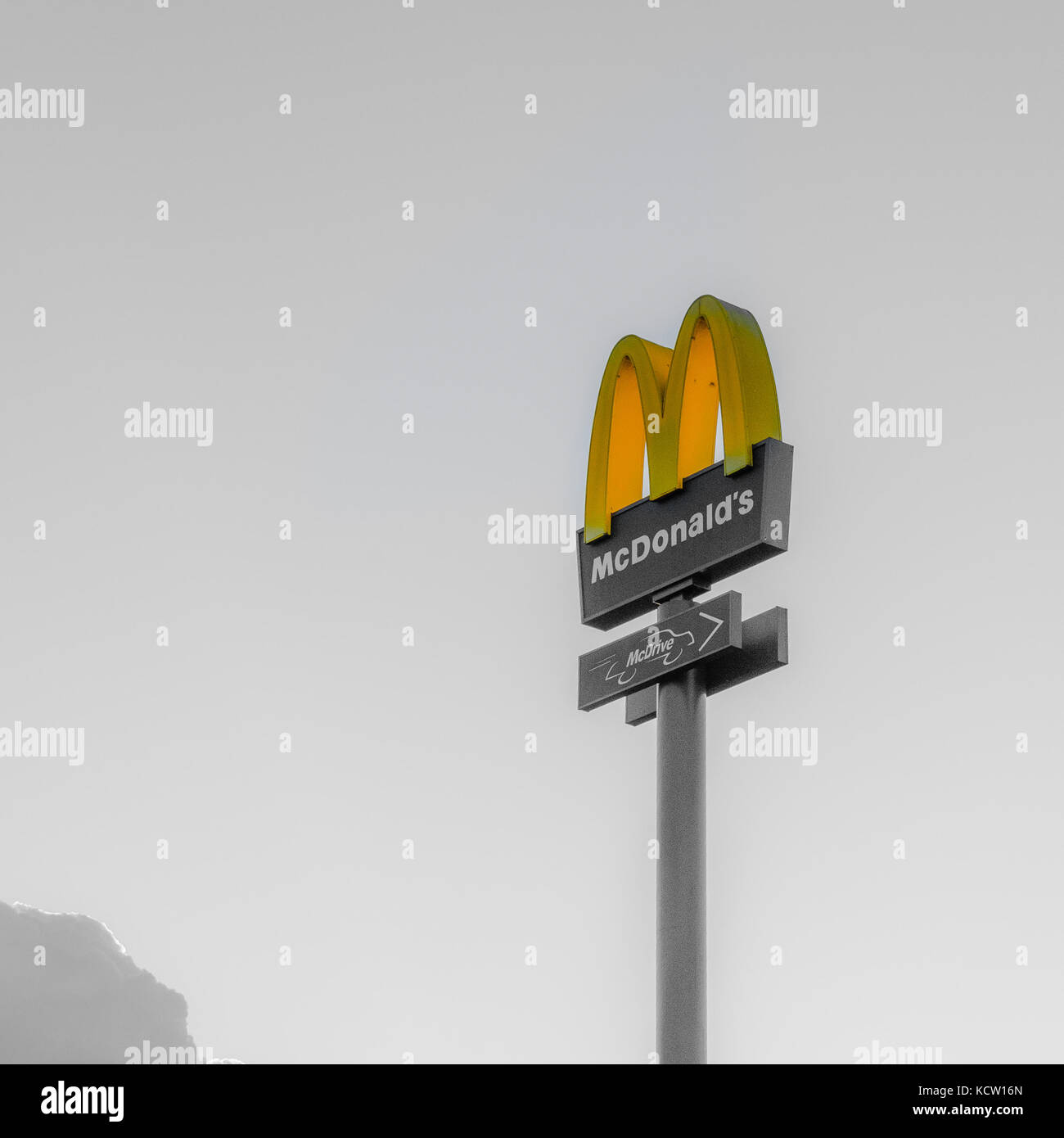 Colour isolated yellow on McDonald's golden arches and McDrive sign ...
