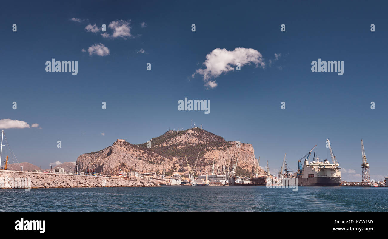 Harbor of Palermo, shipyard, harbor crane and ship, mountains in ...