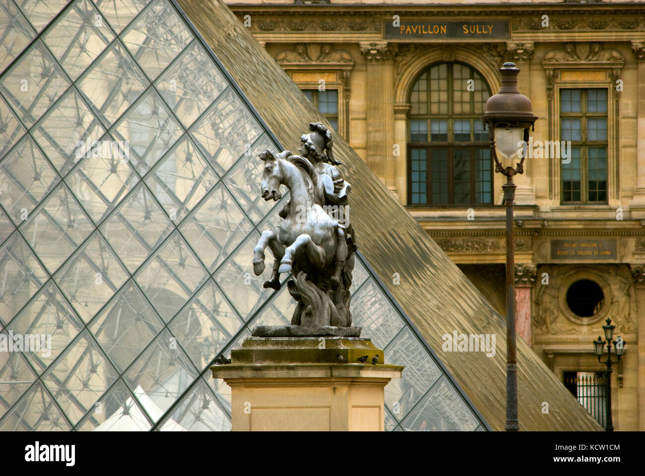 Statue in front of Louvre museum, Paris Stock Photo - Alamy