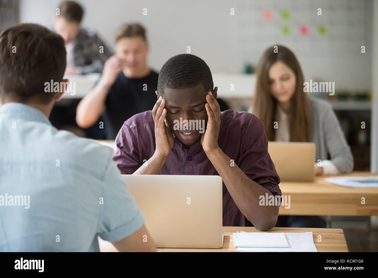 Stressed african-american entrepreneur not feeling well, has bad ...