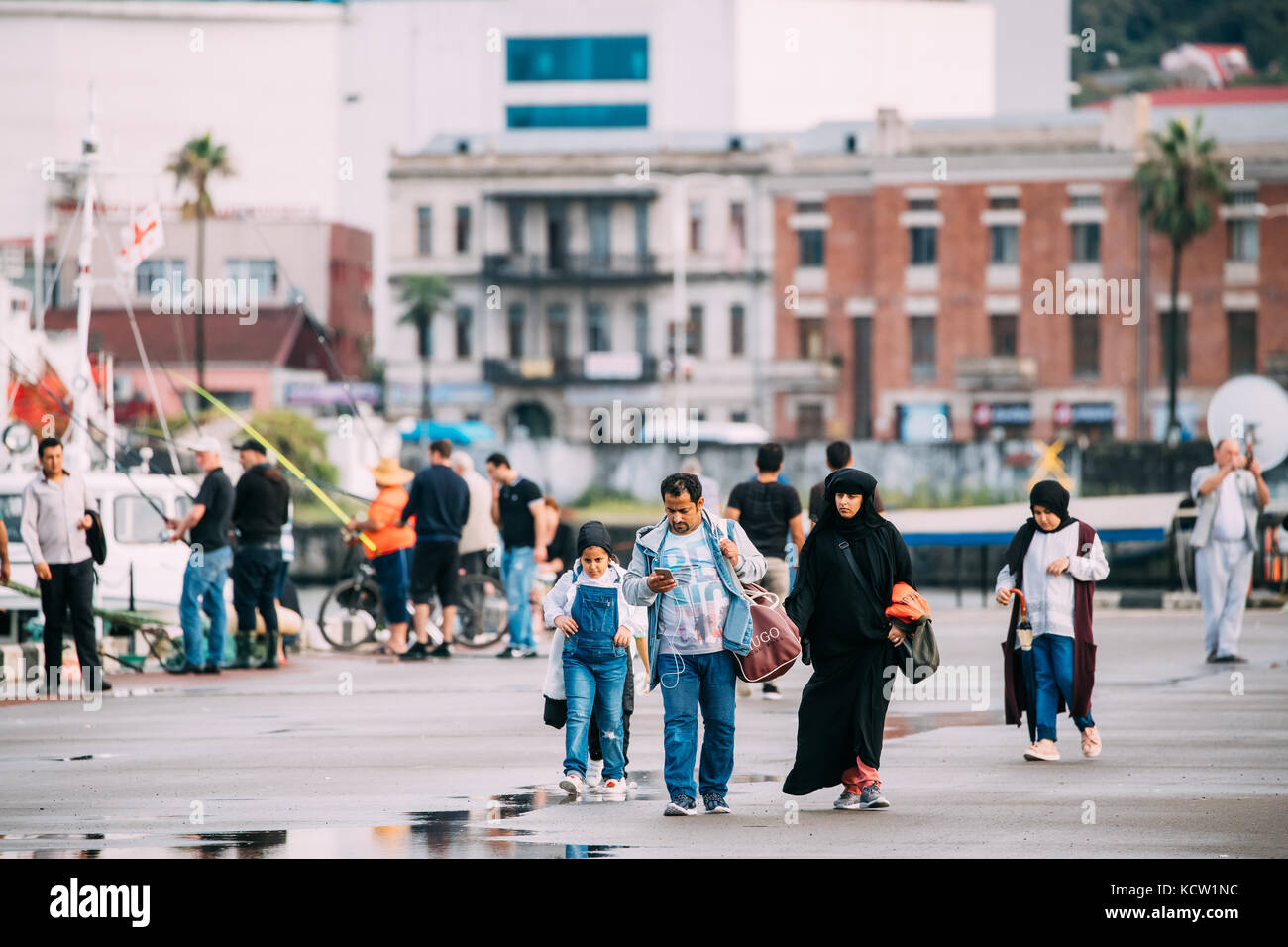 Batumi, Adjara, Georgia. Muslim Family People Walking In Port Dock On ...