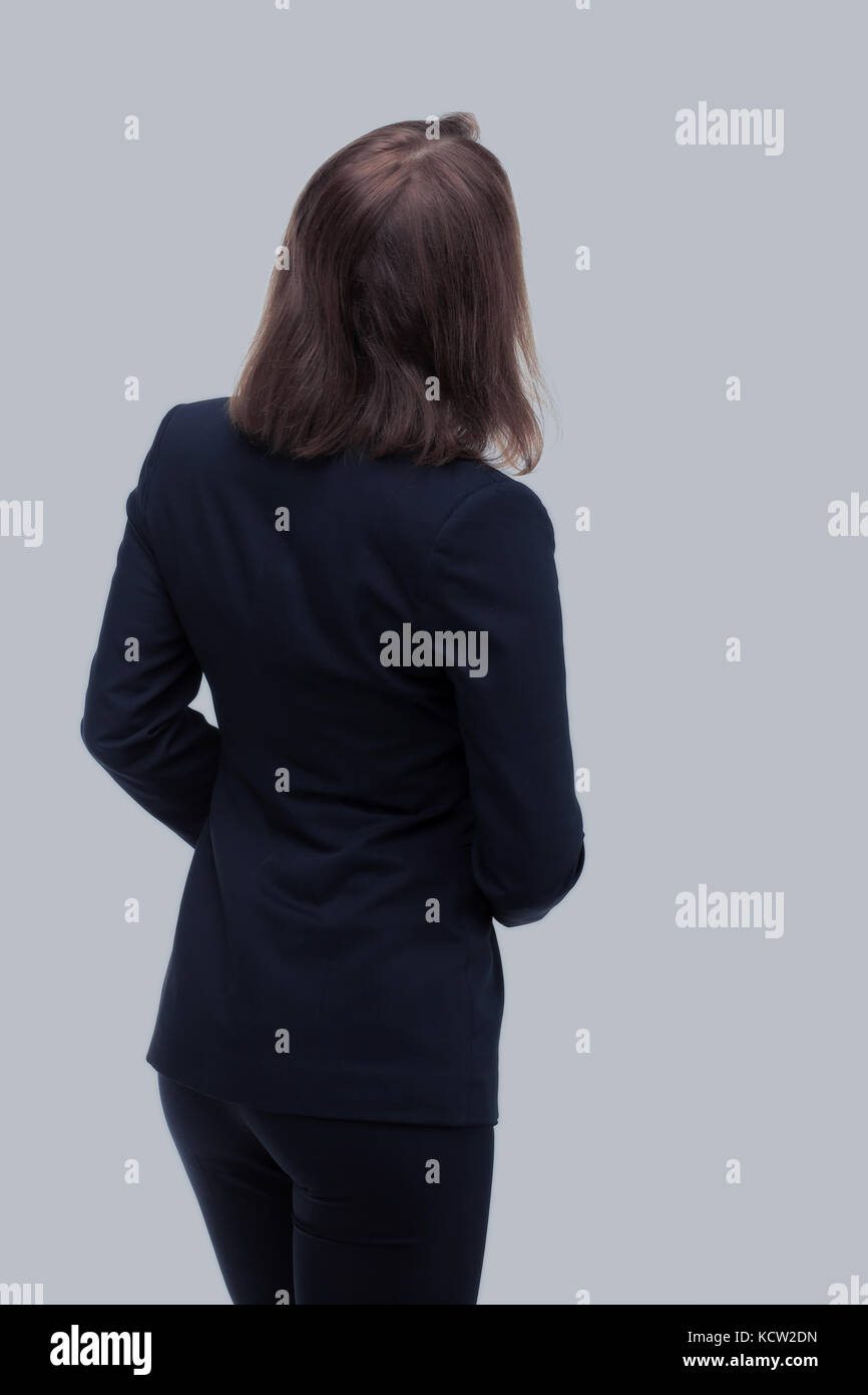 Business woman stand back side looking at white wall background Stock ...