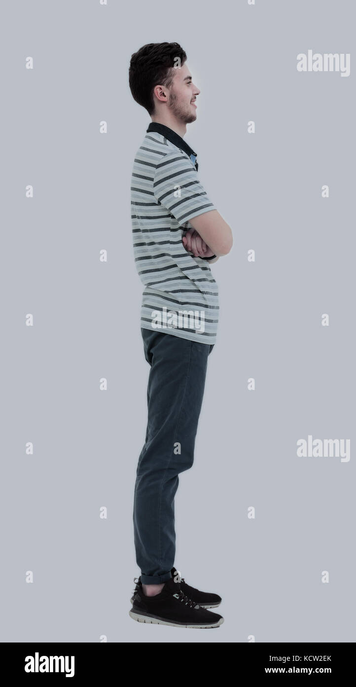 Happy man standing sideways isolated on white background Stock Photo ...