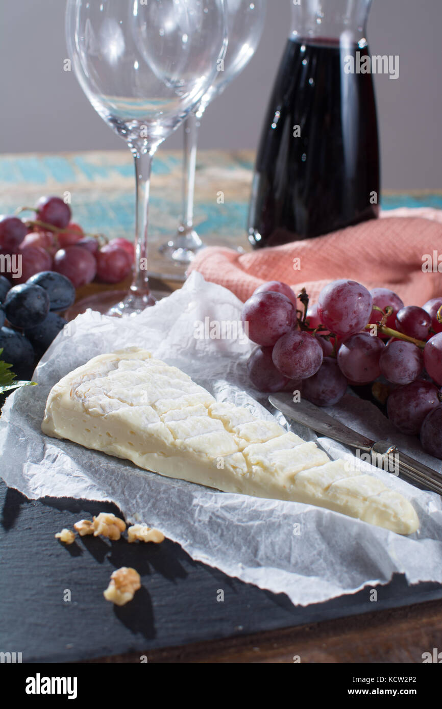 Famous French soft cheese - brie - delicious dessert with nuts, grapes ...