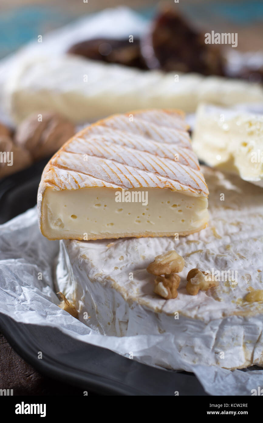 Variety of French soft cheeses - camembert, marcaire, munster, brie ...