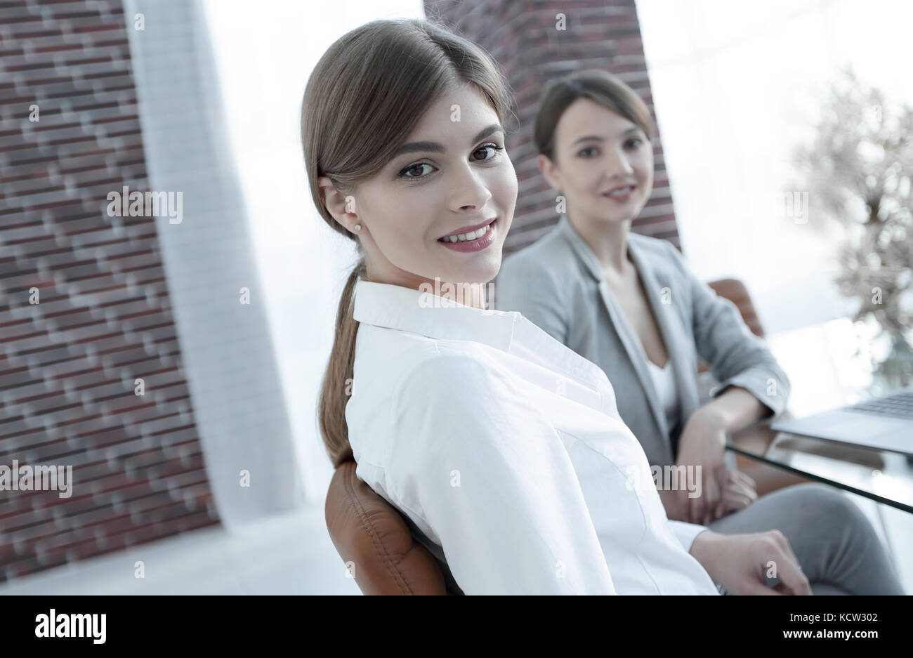office workers sitting behind a Desk Stock Photo - Alamy