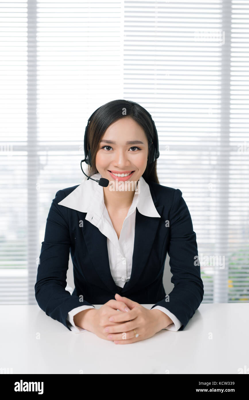 Call center operators. Young beautiful business woman in headset Stock Photo - Alamy