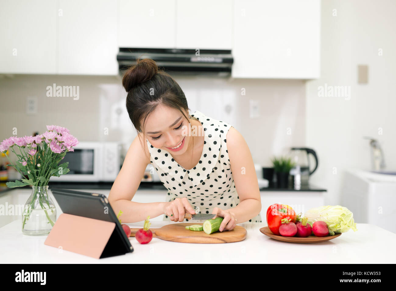 Portrait of young asian beautiful woman cooking in kitchen Stock Photo ...