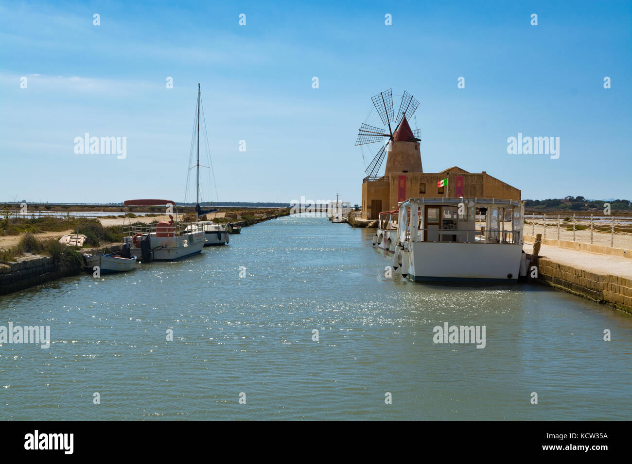 Sea saltworks, salt wind mills are seen in suburbs of Marsala, Sicily ...