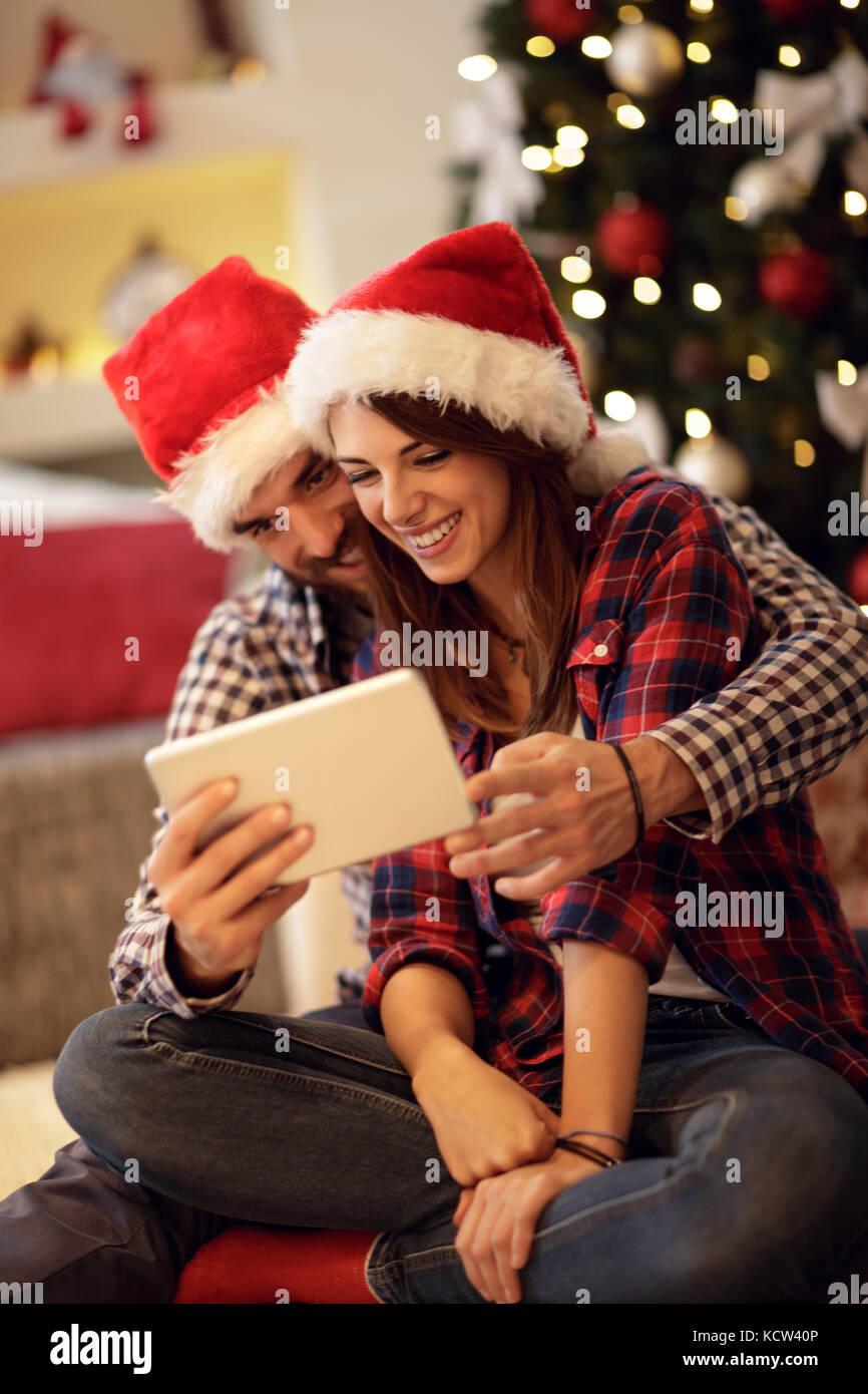 Caucasian couple celebrating something home hi-res stock photography ...