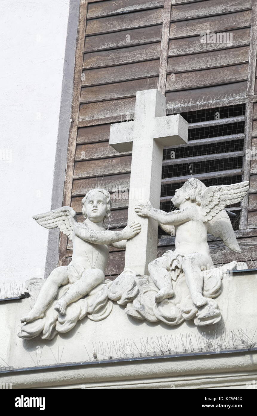 White Angels with Cross in the Window Stock Photo - Alamy