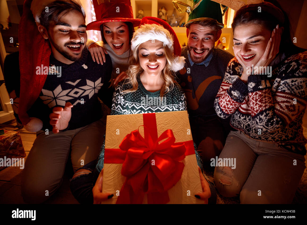 Magic surprise in box for group young friends Stock Photo - Alamy