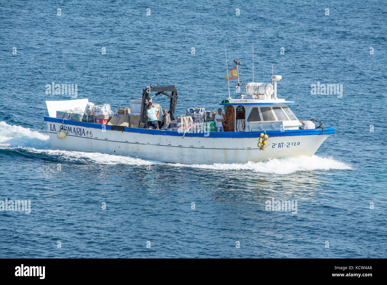 Boat carrying supplies to the remote Spanish island of Tabarca Stock ...